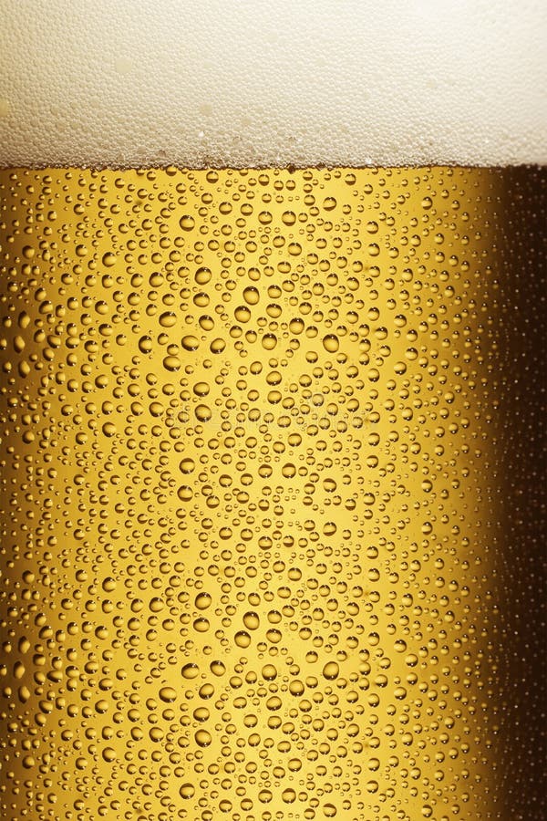 The Texture of Beer Poured into a Glass with Foam and Bubbles Stock ...