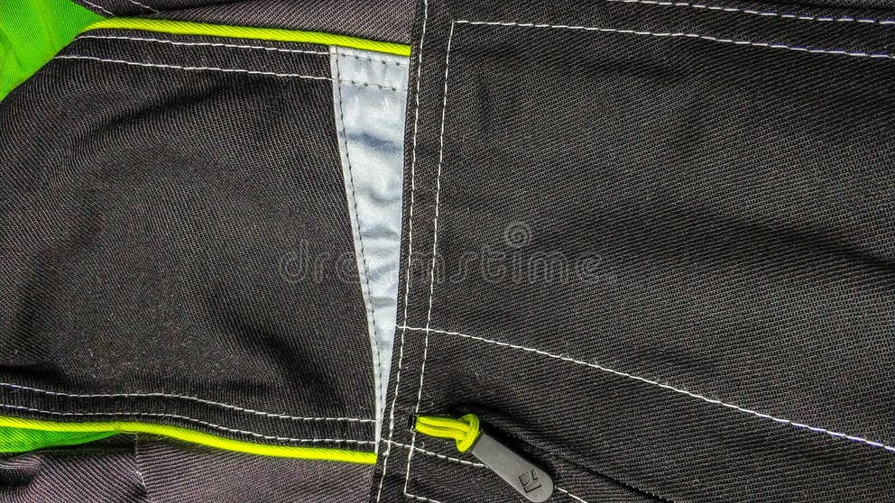 Texture of a Black Work Uniform with Green Reflectors Close-up Stock ...