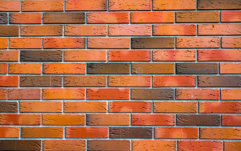 A Large European Style Brick Building among Green Bushes and Trees ...