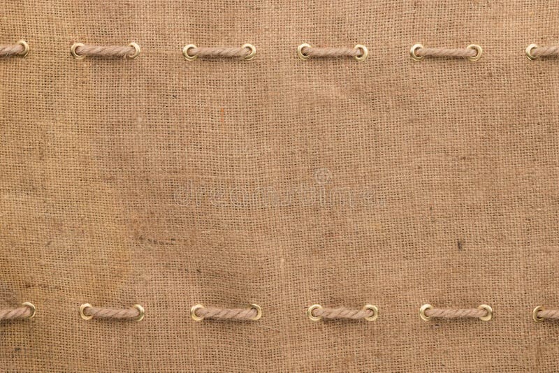 Texture of Burlap with Two Ropes Inserted in Gold Rings. Frame Stock ...