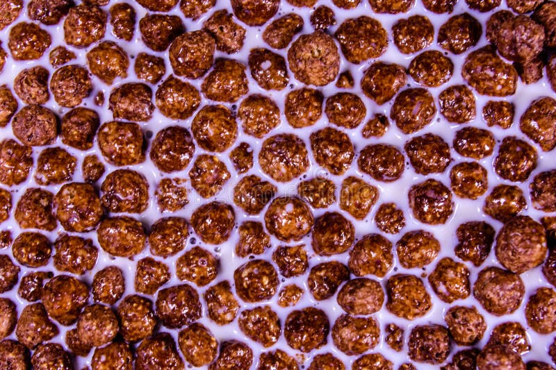 Texture of Chocolate Cereal Balls in Milk for the Background Stock ...