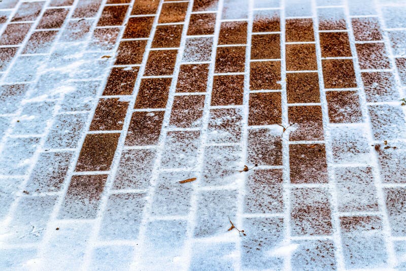 The Texture of the Cobblestone Path Covered with the First Snow in ...