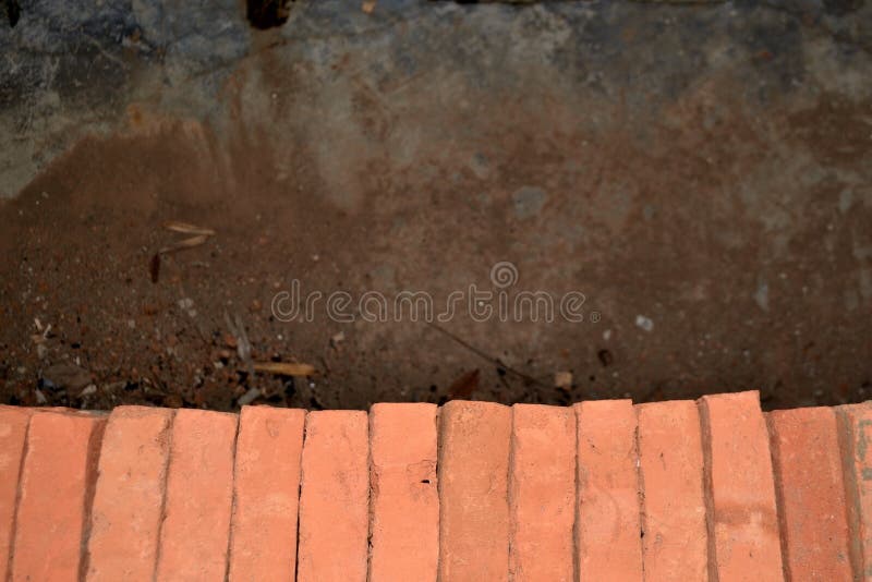 Rows of Red Bricks Neatly Arranged Against the Ground Background Stock ...