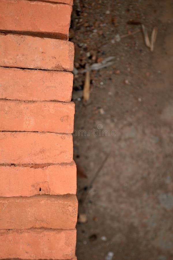 Rows of Red Bricks Neatly Arranged Against the Ground Background Stock ...