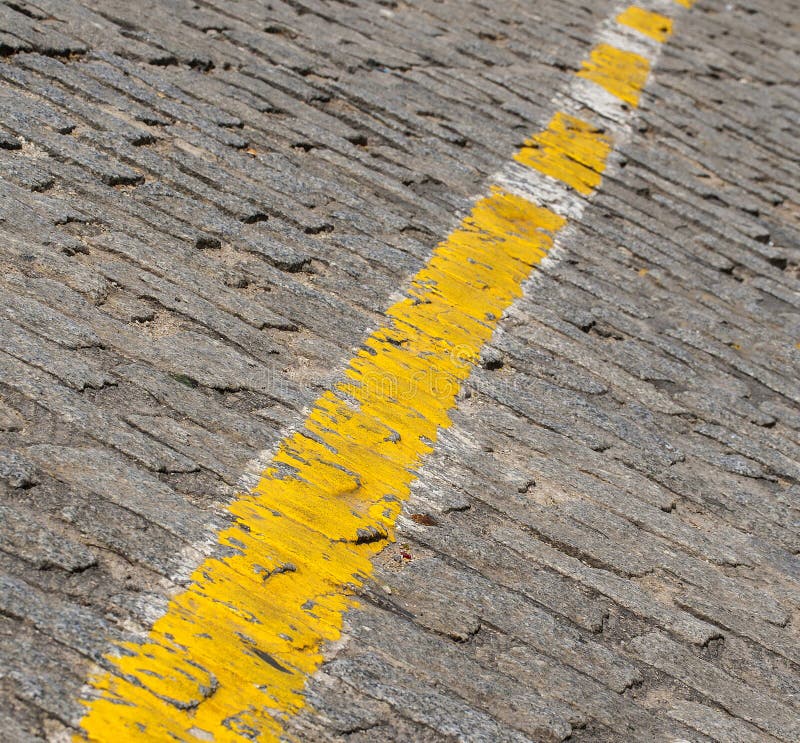 Texture of Dark Grey Cobblestones with Yellow Stripe As Road Marking ...