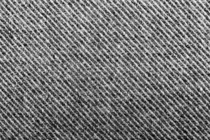 The Texture of the Fabric is Black with Straight White Stripes ...