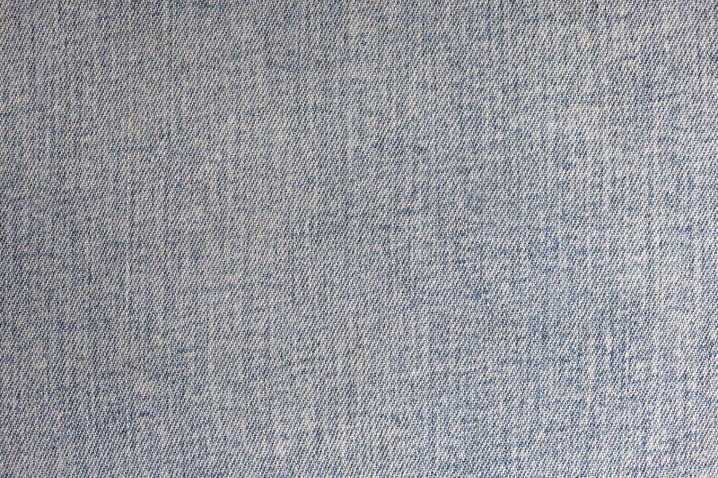 The Texture of the Fabric of Worn Jeans. High Resolution Photo Stock ...