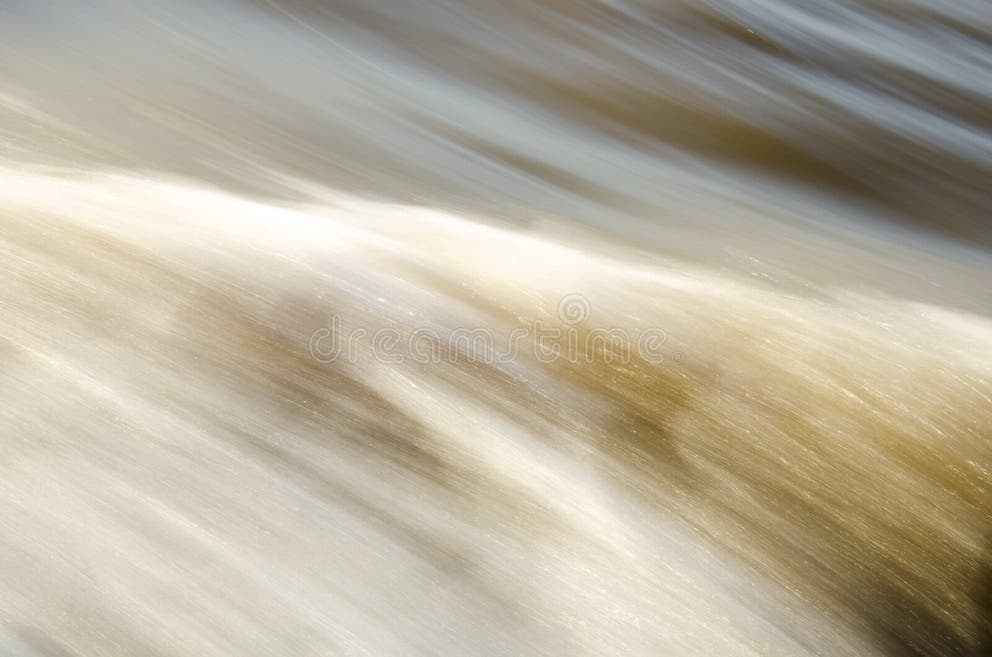Texture of Fast Moving Water, in Yellowish Soft Tones Stock Photo ...