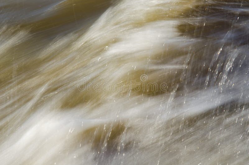 Texture of Fast Moving Water, in Gray and Yellowish Tones Stock Photo ...