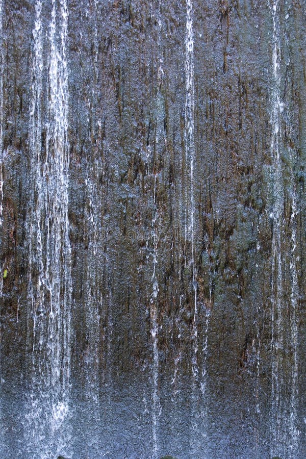 Texture of a Flowing Waterfall on the Wall, Background, Vertical Stock ...