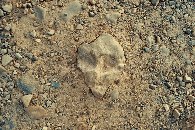 The Texture in the Form of a Face of an Alien on a Natural Stone. Stock ...