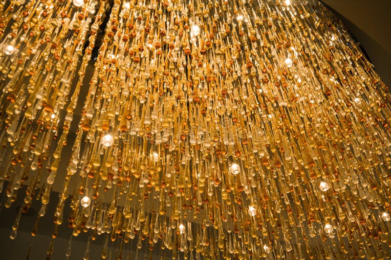 Texture Glass Chandelier with Small Bulbs of Yellow Stock Image - Image ...