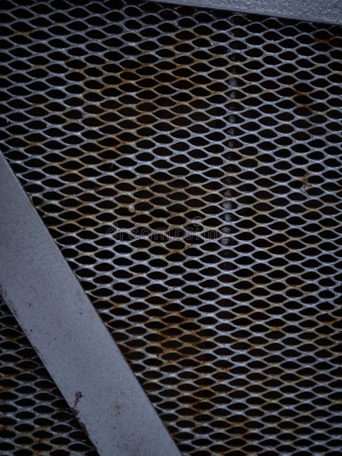 Texture of a Gray Metal Grate with Various Elements Stock Photo - Image ...