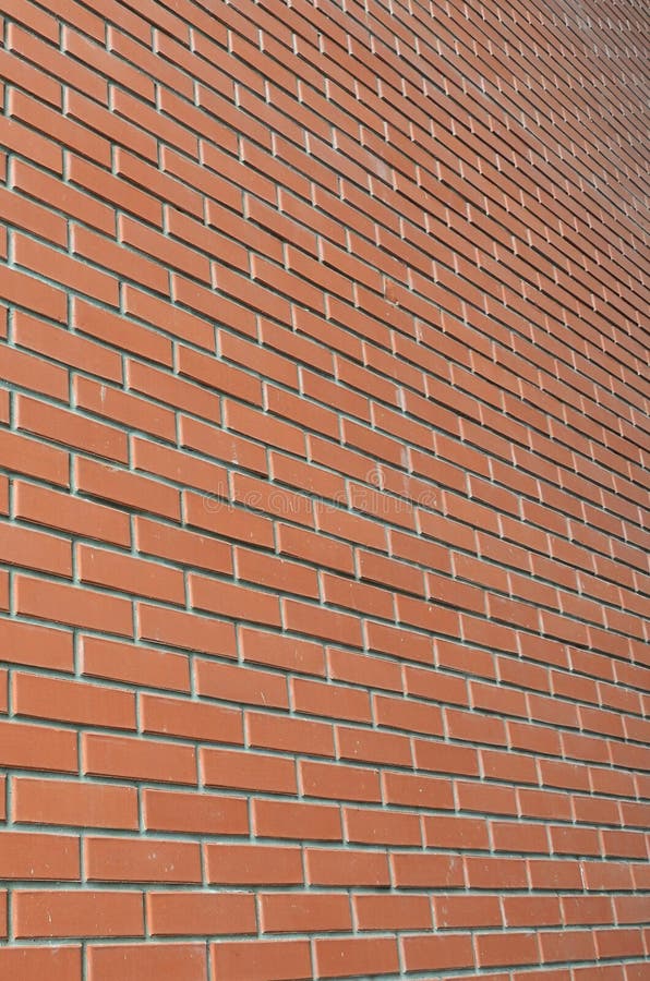 The Texture of a High Brick Wall from a Many Rows of Red Bricks ...