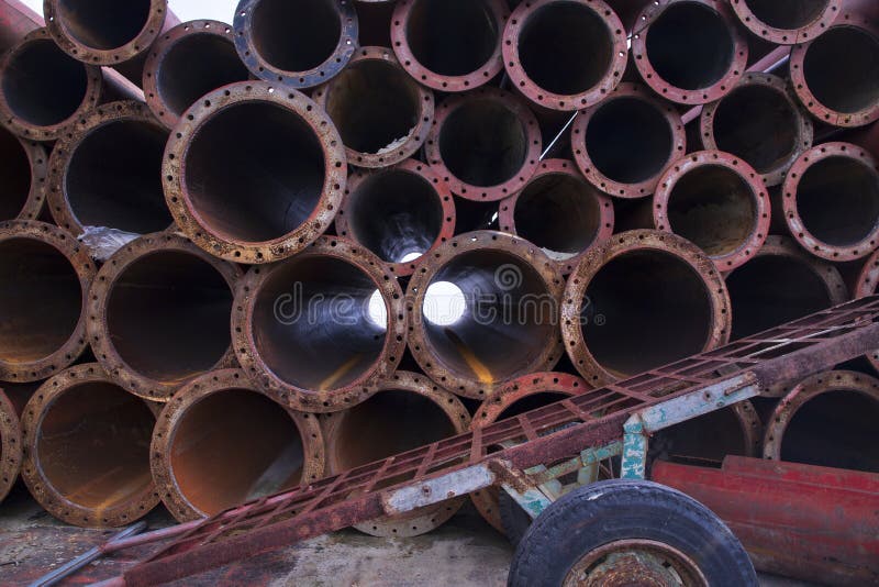 A Texture Industrial Background of Rusty Iron Pipes Stack Stock Photo ...