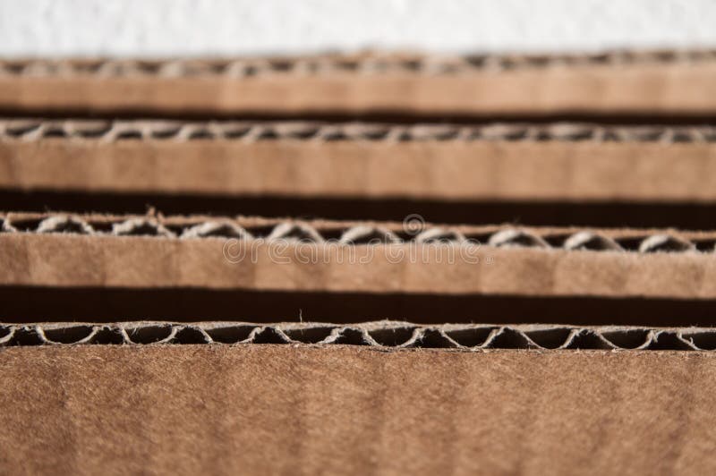 Texture of Brown Cardboard Side. Folded Cardboard Boxes Against Stock ...