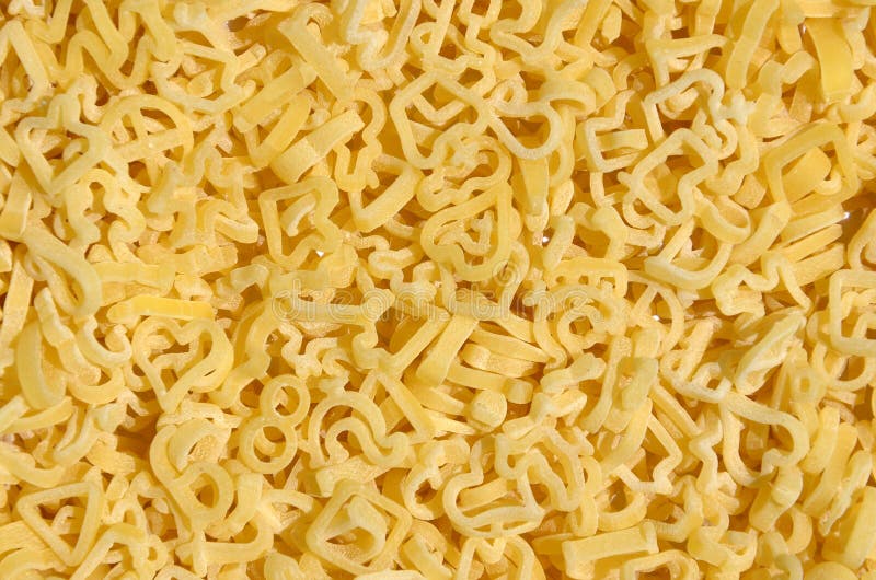Texture of a Lot of Curly Raw Yellow Pasta Stock Photo - Image of ...