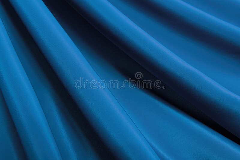 He Texture of a Luxurious Smooth Fabric in Blue with Folds and Waves ...