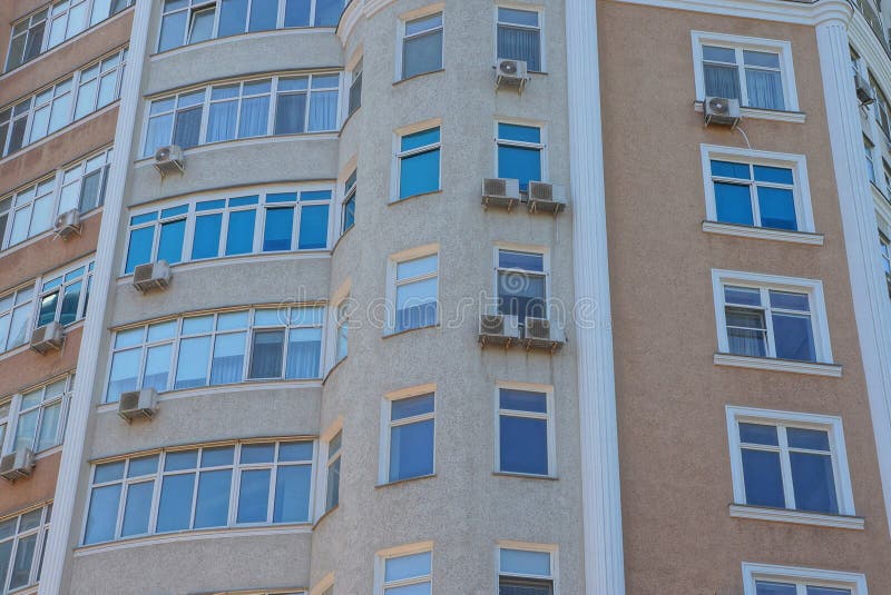 Texture from Multiple Windows on a Brown Concrete Wall Stock Photo ...