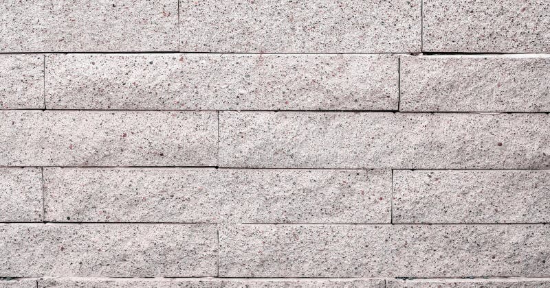 Texture of a Natural Stone Wall Made of Rectangular Blocks As a Pink ...