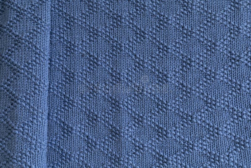 A Texture of a Navy Blue Knitted Blanket in Brocade Knitting Pattern ...