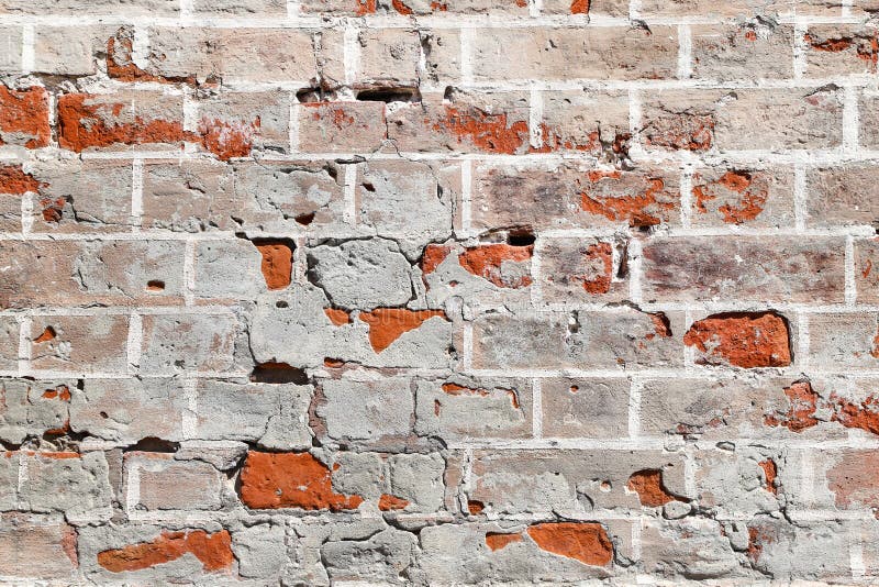 An Old Damaged Brick Wall Partially Covered with Old Cracked ... An Old Damaged Brick Wall Partially Covered with Old Cracked ...