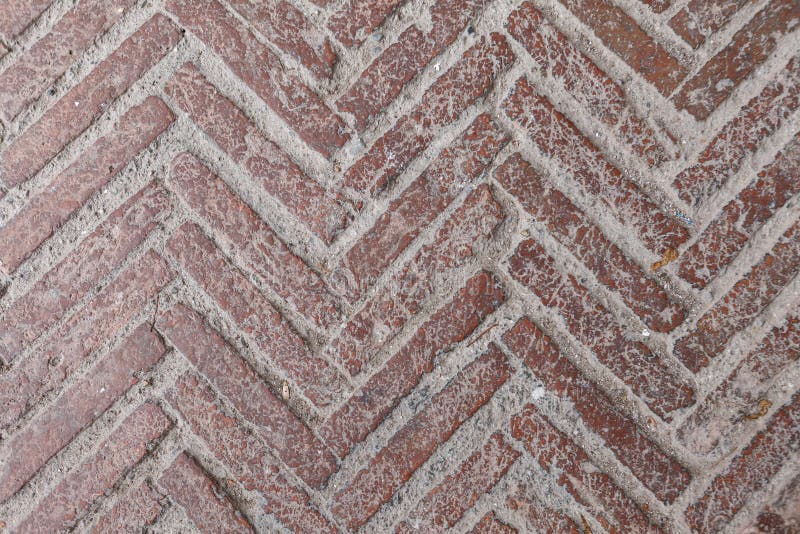 The Texture of the Old Herringbone Pavement of Bricks Stock Photo ...