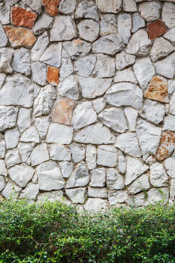 Texture Old Rock Wall Made of Random Stone Stock Image - Image of grass ...