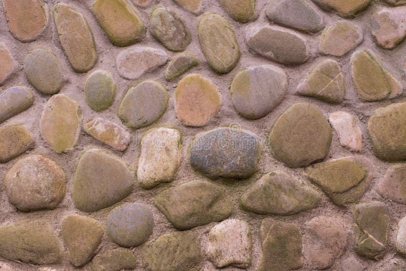 Texture of an Old Wall Made of Round Stone, Sandstone, River Stone ...