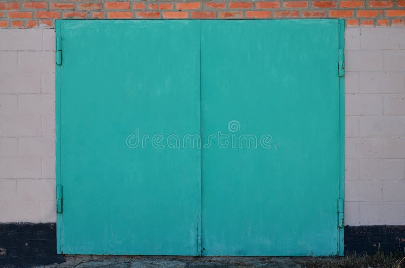 The Texture of a Painted Metal Gate from a Brick Garage Stock Photo ...
