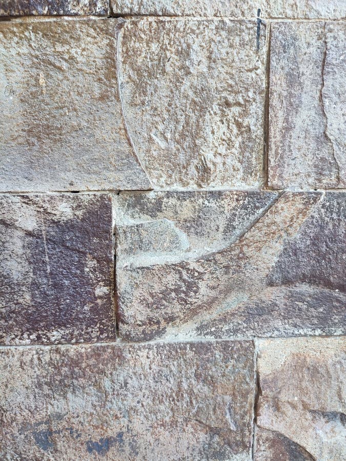 A Wall Displays a Striking Pattern of Alternating Light and Dark Bricks ...