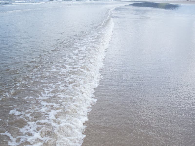 Texture of Ripples with Foam at the Seaside. Stock Photo - Image of ...