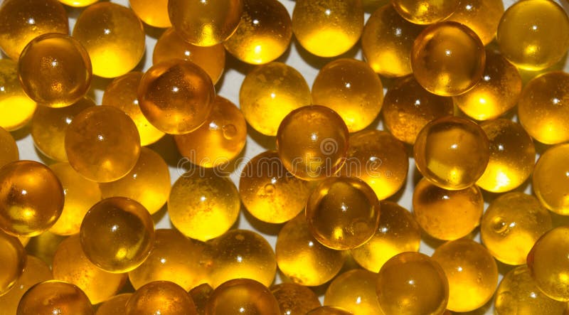 Translucent Gold Whiskey with Ice Cubes in Glass Stock Image - Image of ...