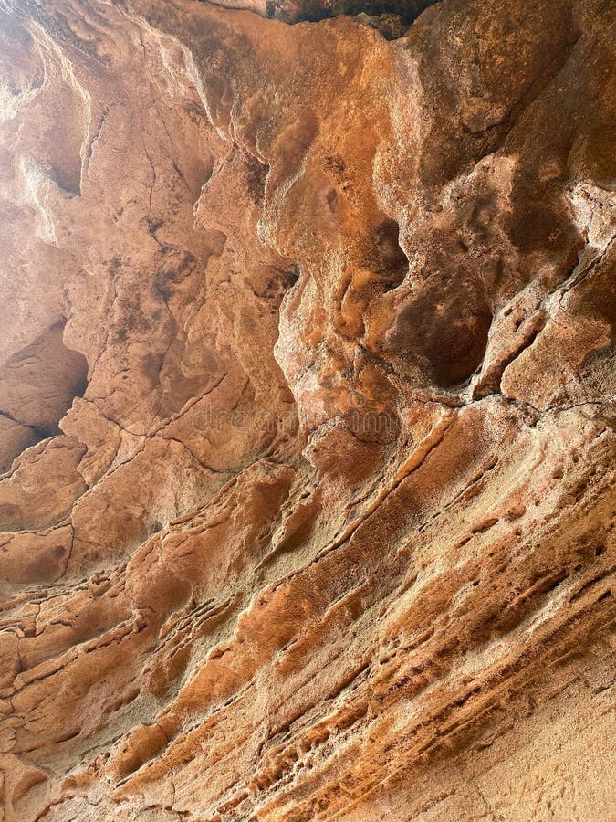 Texture of Sandstone in a Cave in the Rays of the Sun. Stock Photo ...