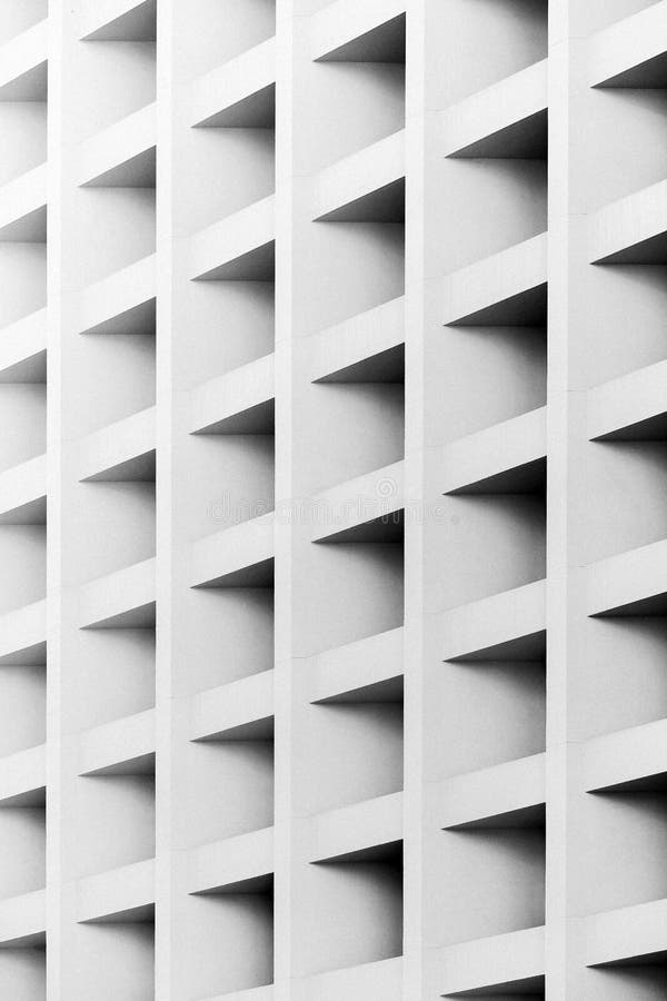Texture of Square Shaped Office Windows on a Marble Covered Building ...