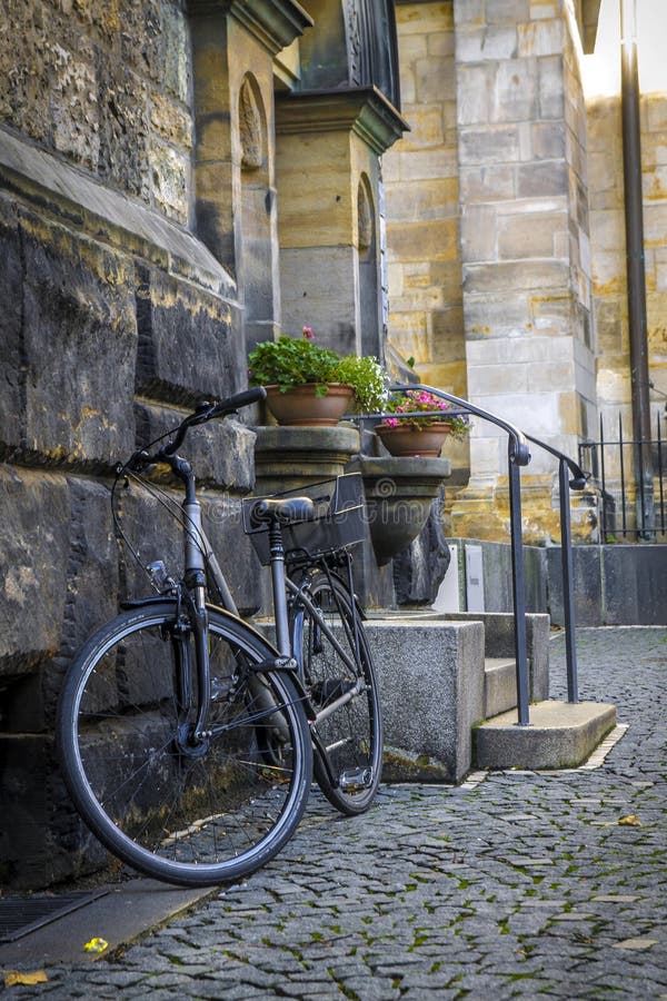 Texture of Stone and Cobblestone, Bicycle on a City Street Editorial ...