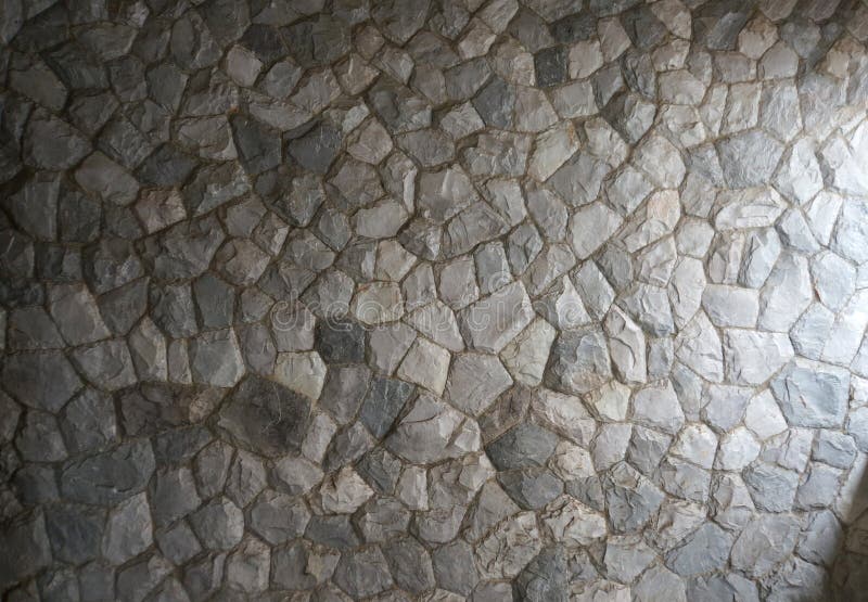 The Texture of the Stone Wall Looks Solid in the Dim Light. Stock Image ...