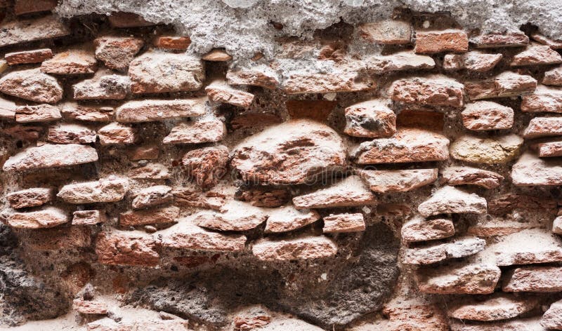 Texture of a Stone Wall of an Old Building with Crumbling Plaster ...