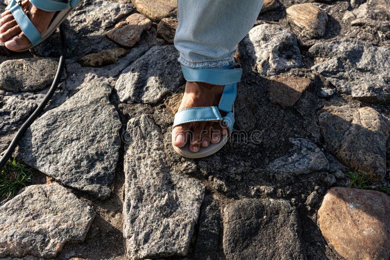Texture of Stones on the Ground. a Human Foot Treads the Ground Stock ...