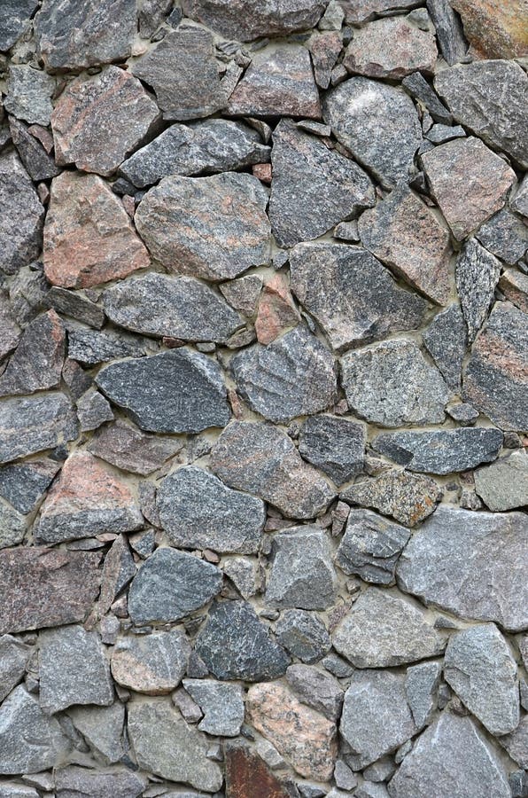 The Texture of a Strong Stone Wall of Many Concreted Stones of Various ...