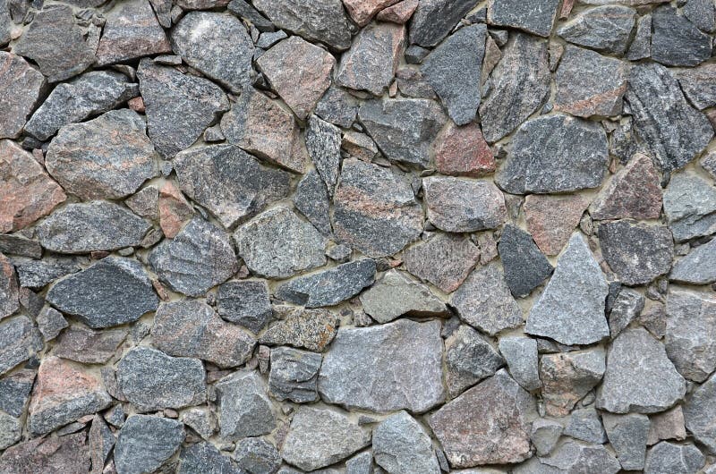 The Texture of a Strong Stone Wall of Many Concreted Stones of Various ...