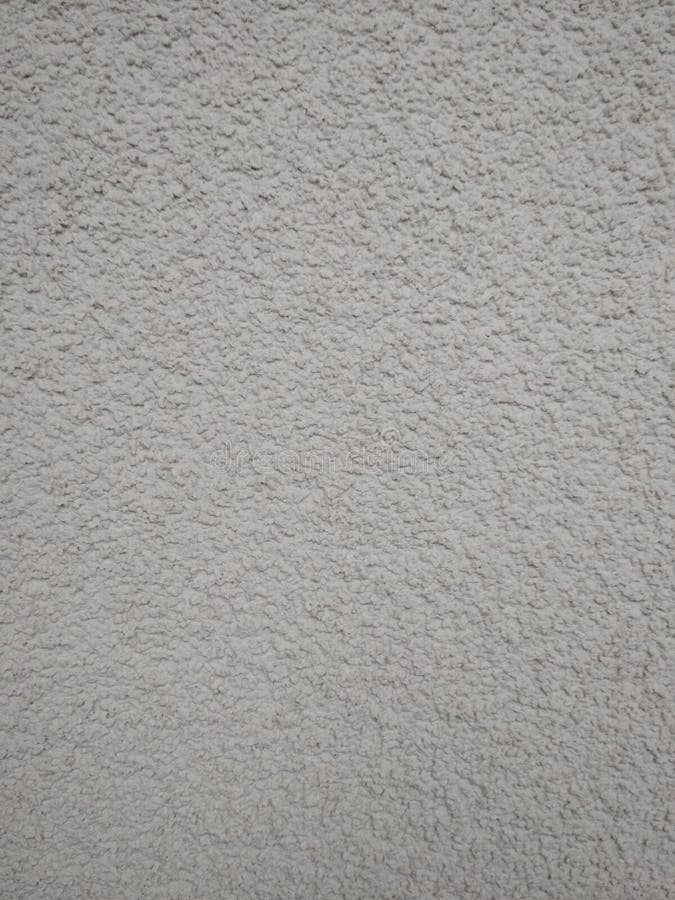 The Texture of the Wall with an Unusual Mottled Texture Painted White ...
