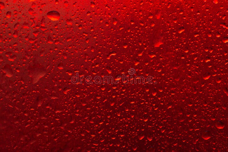 The Texture of a Water Drop on a Red Background Close-up Stock Image ...