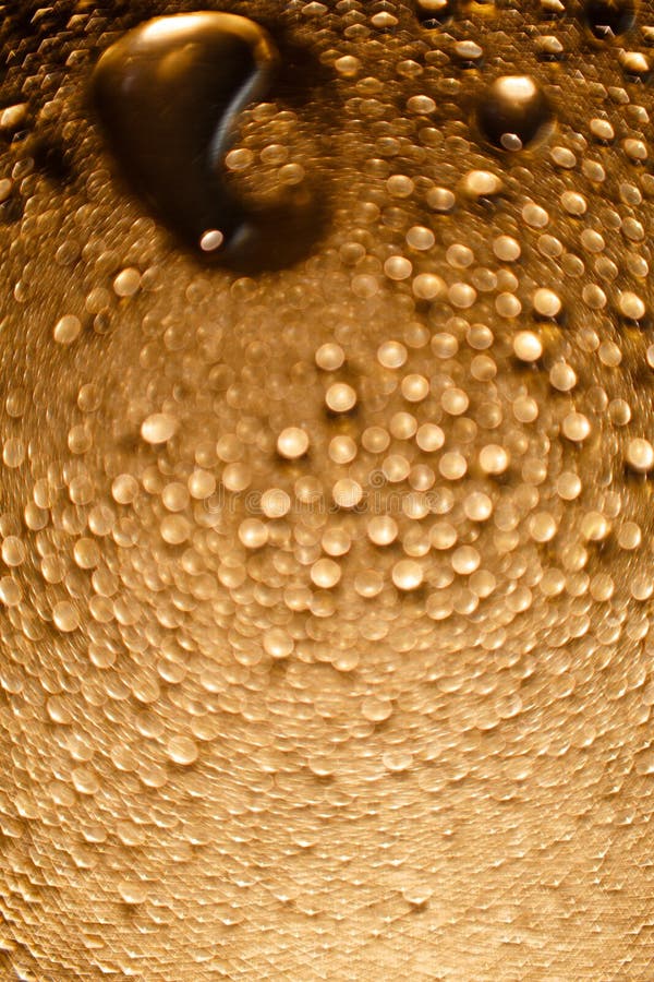 Texture of a Water Drop on a Shiny Gold Background in a Blur. Stock ...