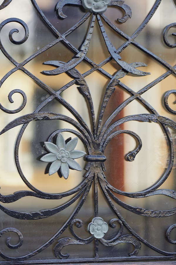 The Texture of the Wrought-iron Grille on the Window.Close. Artistic ...