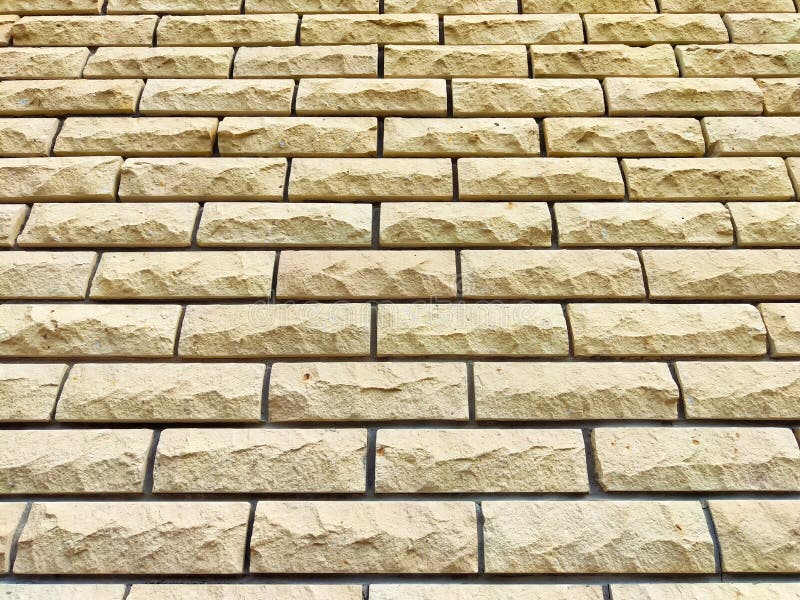 Textured Beige Bricks Arranged in a Pattern on a Wall during Bright ...