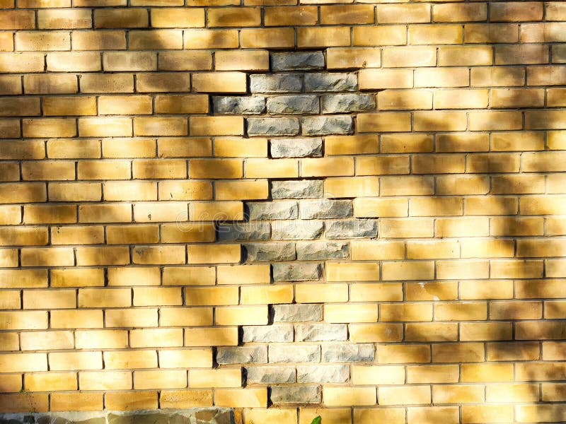 Textured Brick Wall with Shadow Patterns Highlighting Irregular ...