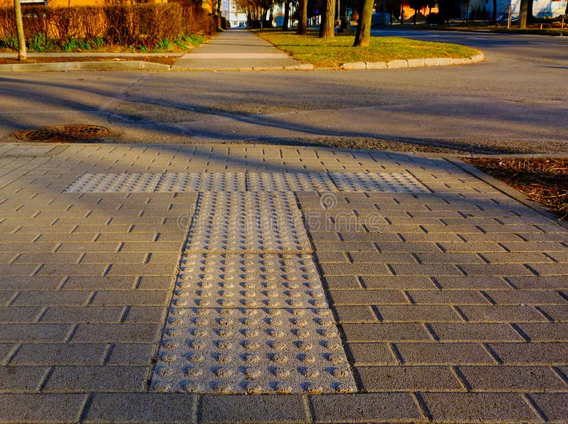 Textured Bumpy Section of Concrete Sidewalk Nearing Street Intersection ...