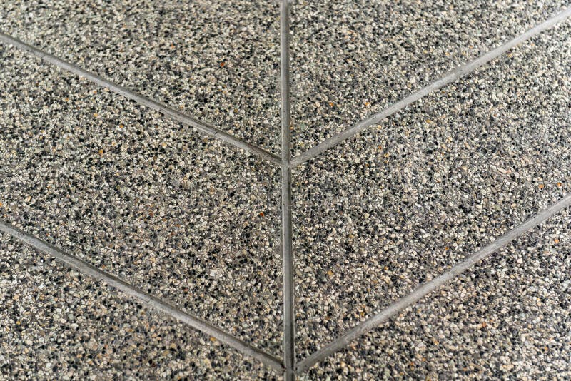 Textured Concrete Surface with Geometric Arrow Pattern, Neutral Tones ...
