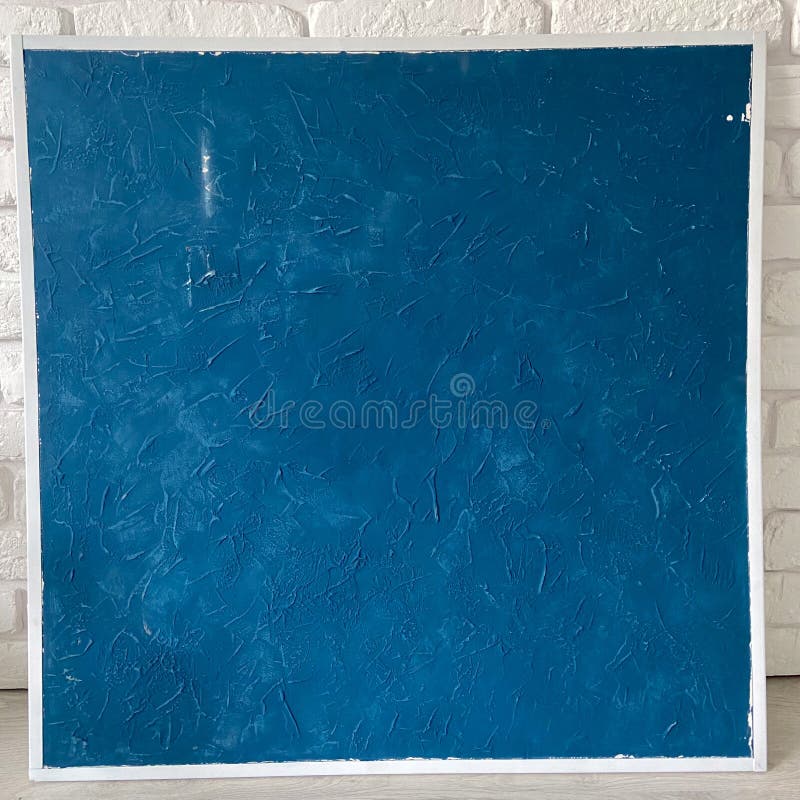 Textured Deep Blue Panel is Set Against a White Brick Wall, Emphasizing ...